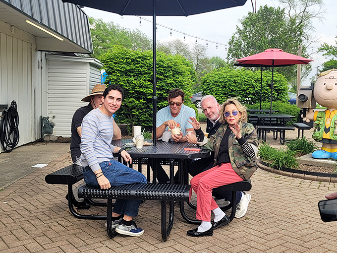 At Buddy's outdoor tables, strangers become friends united by the universal language of "you've got to try this" and "no, you can't have a bite."