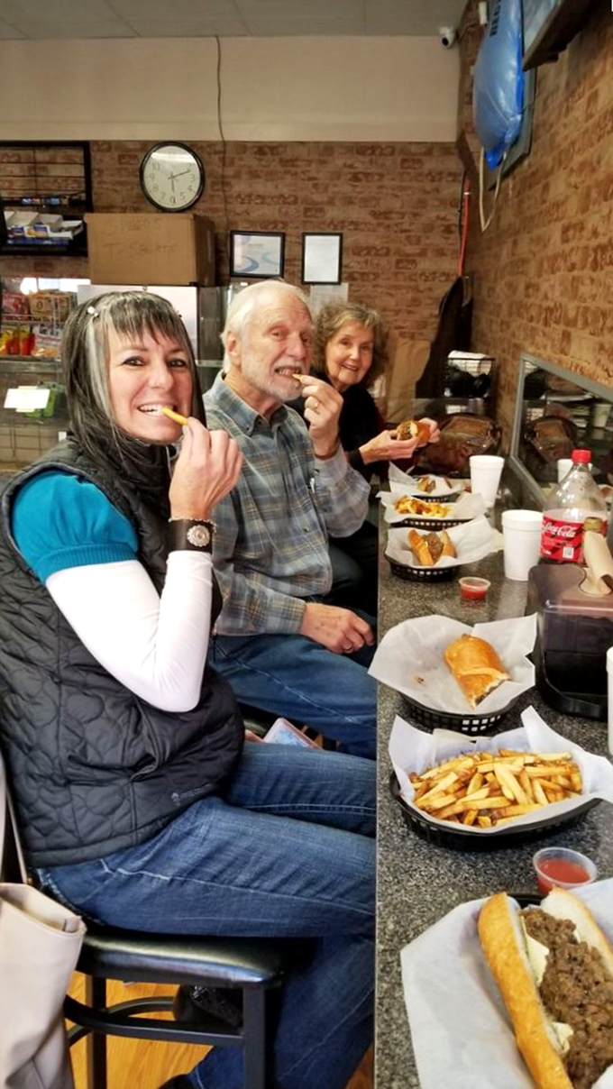 Happy diners experiencing that moment when conversation stops and appreciative mumbling begins. The universal language of great food.