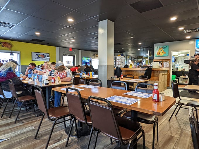 Happy diners enjoying the kind of meal that turns strangers into friends and regular customers into extended family members.