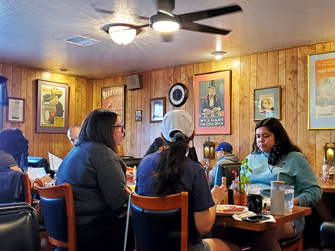 The dining room hums with the satisfied murmurs of barbecue devotees. Conversations pause mid-sentence when forks deliver that first perfect bite.