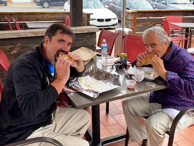 Two happy customers experiencing what philosophers call "sandwich nirvana" &ndash; that moment when all worldly concerns disappear between two pieces of bread.