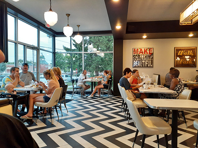 The chevron floor pattern leads your eye to what matters most&mdash;happy diners enjoying meals beneath those globe lights that cast everyone in their best light.