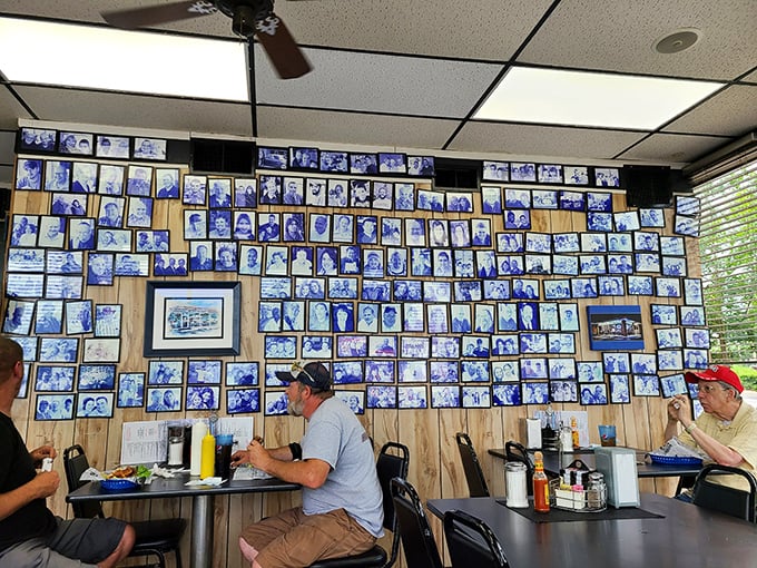 The wall of photographs tells stories of countless meals shared. In the diner universe, these are the constellations guiding hungry travelers home.