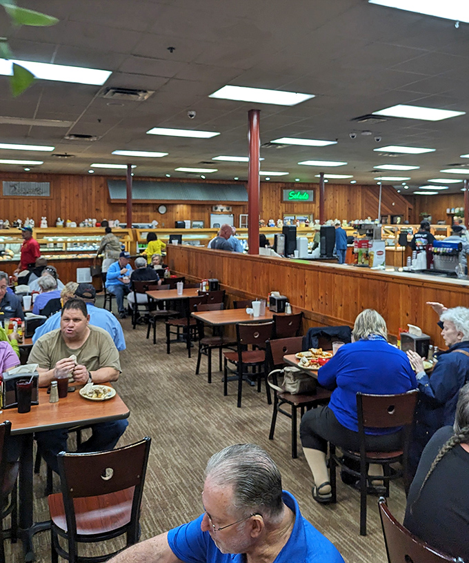Where locals gather to debate important matters like whether banana pudding counts as a vegetable. The buffet line in back is the real town hall.