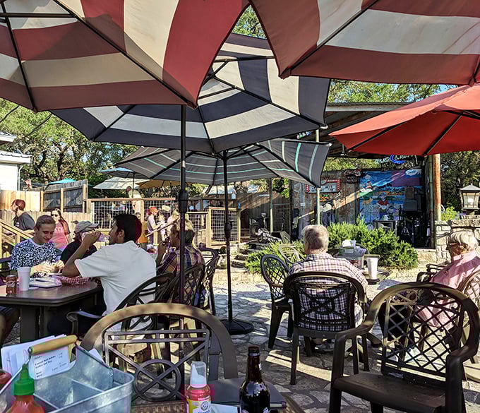 Under a patchwork of patio umbrellas, strangers become friends and friends become family, united by the universal language of exceptional food.
