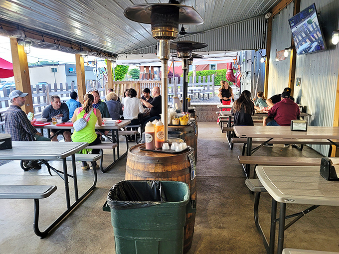 The outdoor dining area buzzes with the universal language of "mmm" and "pass the napkins"—barbecue's version of a United Nations assembly.