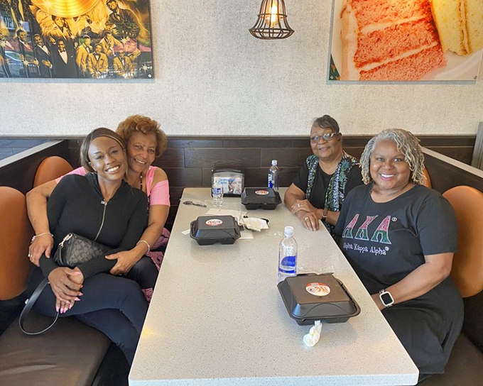 Happy diners sharing a moment that perfectly captures why we break bread together &ndash; it's never just about the food.