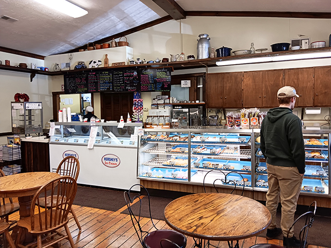 The bakery's dining area offers front-row seats to pastry paradise. Those wooden tables have witnessed countless "Oh my goodness" moments and diet resolutions crumbling in real time.