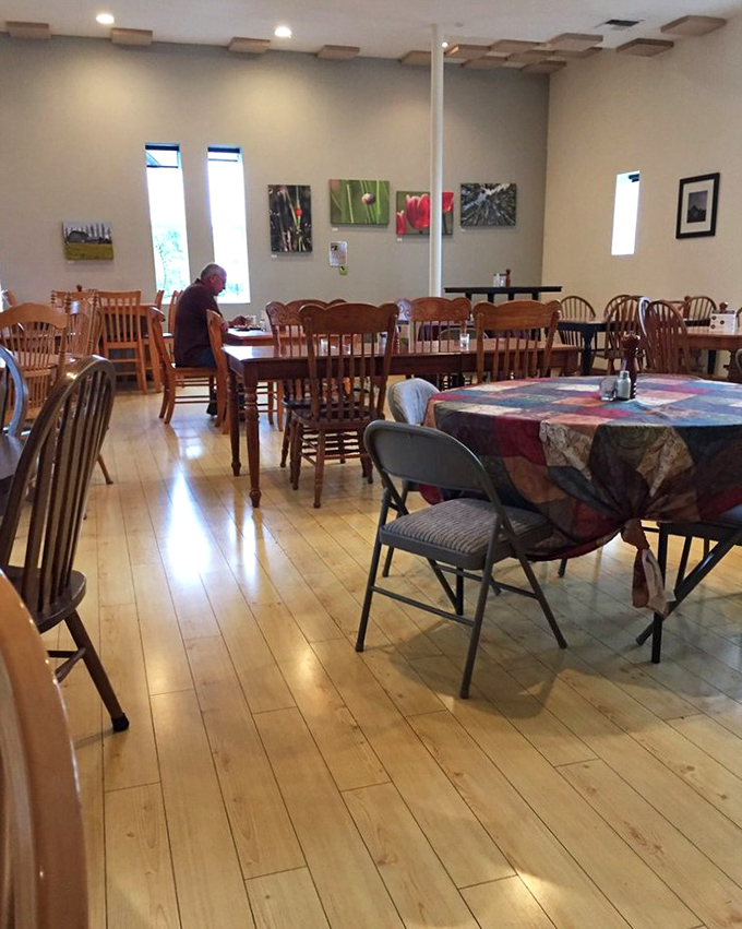 The dining area invites lingering conversations and second helpings. Tables positioned perfectly for both eating and eyeing what others ordered.