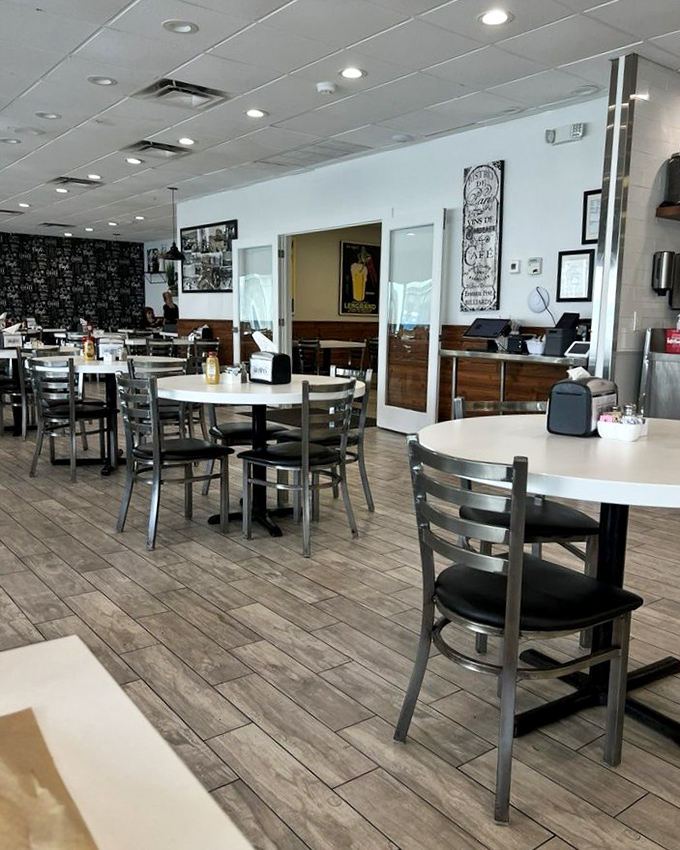 Modern simplicity meets old-school service in a dining space where conversations flow as freely as the coffee refills.