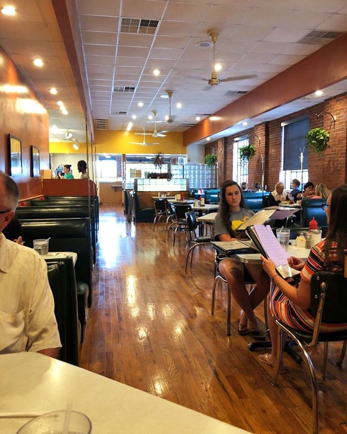 The polished wooden floors have witnessed countless coffee refills and "just one more bite" moments in this sunlit sanctuary.