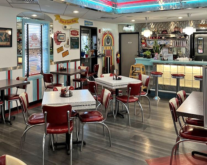 The dining area isn't just serving meals&mdash;it's serving memories with every chrome-edged table and vinyl chair that invites you to stay awhile.