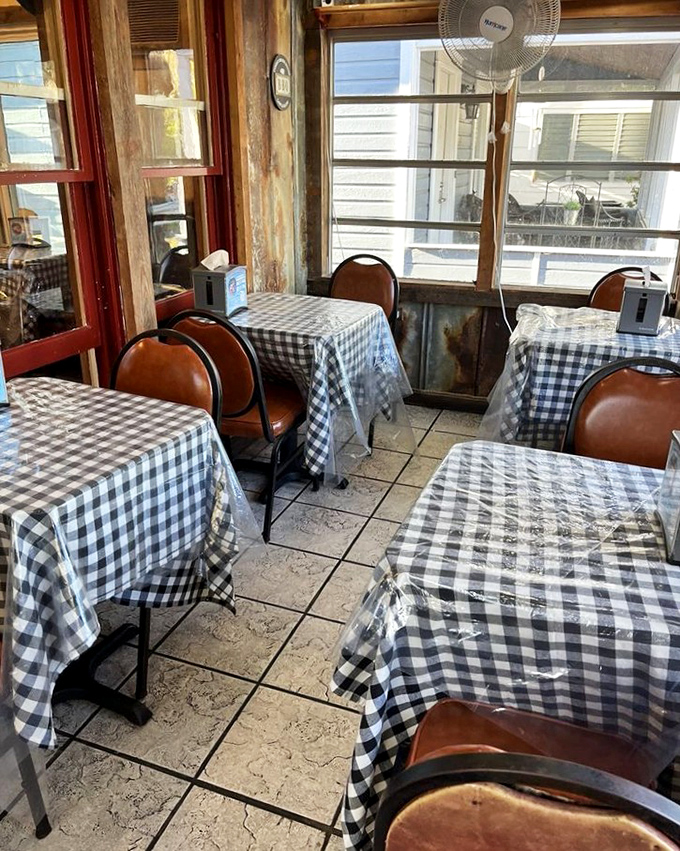 Black and white checkered tablecloths: the universal signal that you're about to eat something that makes your doctor nervous but your soul happy.