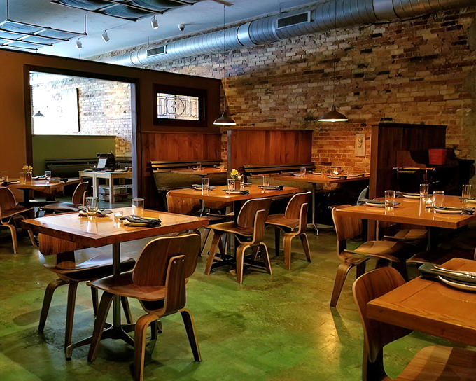 The dining room whispers "stay awhile" with its warm wood tones and brick walls. Like your coolest friend's loft, if your friend were an exceptional chef.