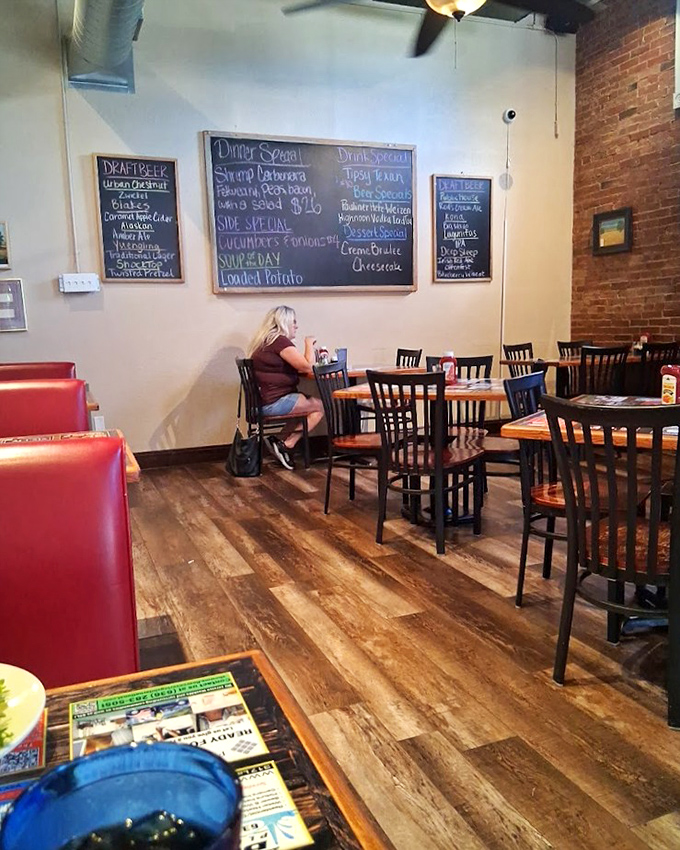 Chalkboards announcing daily specials, exposed brick walls, and a dining room where conversations flow as easily as the local beverages.