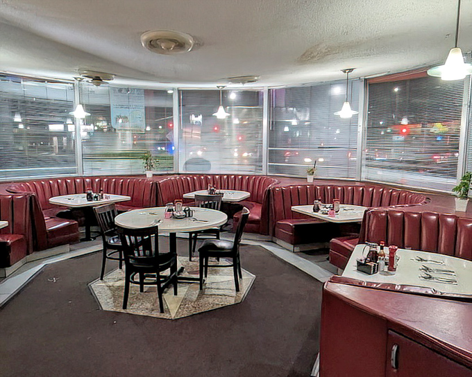 Red vinyl booths curve around the dining room like a 1950s dream. The kind of place where important family announcements are made over pie.
