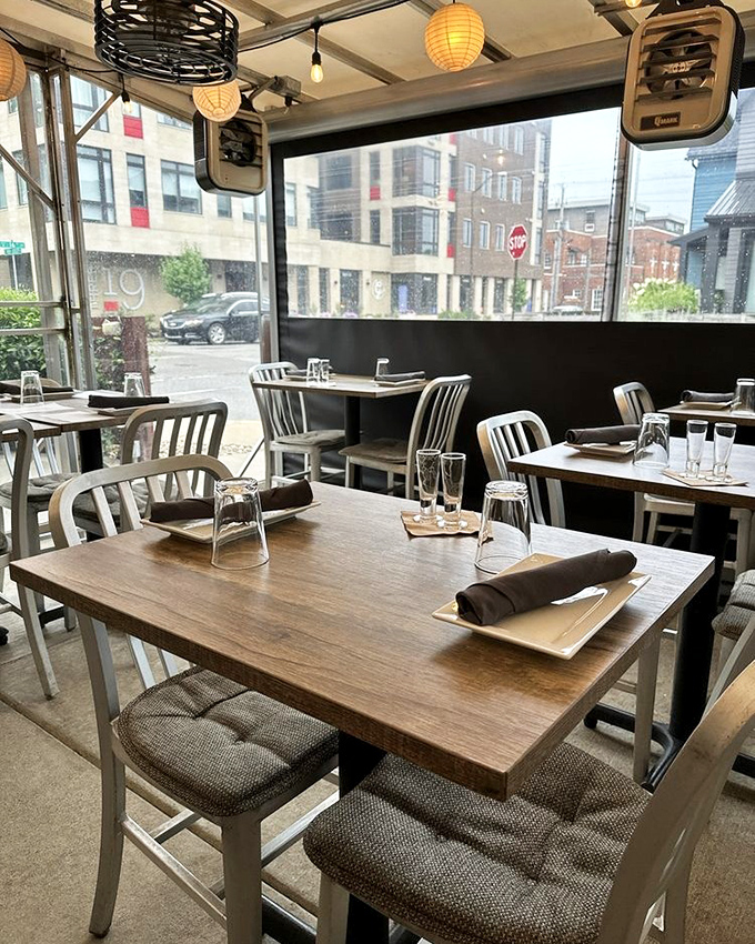 Natural light floods the dining space, where wooden tables and metal chairs create that perfect "I've discovered something special" atmosphere.