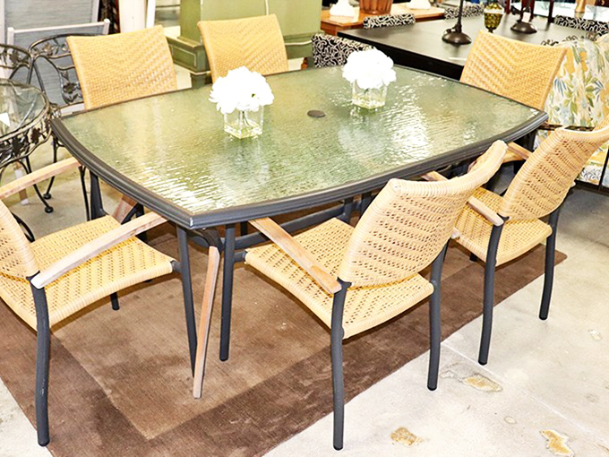 This glass-topped dining set isn't just furniture; it's the backdrop for future family arguments about politics and compliments about potato salad. 