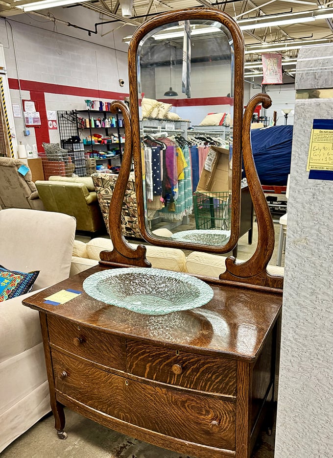 This vintage oak dresser with tilting mirror has witnessed more morning routines than a barista at the busiest coffee shop in town.