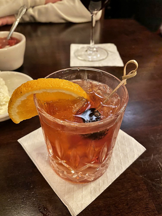 This isn't just another Old Fashioned&mdash;it's liquid amber with an orange twist that whispers, "The steak is coming, but let's enjoy this moment first."
