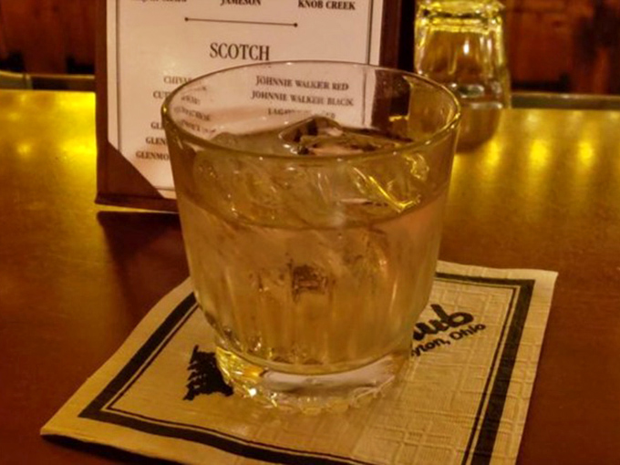 A properly made cocktail in a proper glass on a proper napkin &ndash; civilization still exists, and it's sitting right here on this bar.