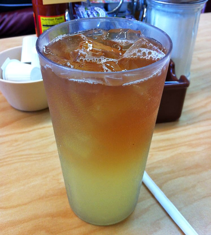 Sweet tea so perfectly layered it's like a sunset in a glass. The kind of drink that makes you forget smartphones exist.