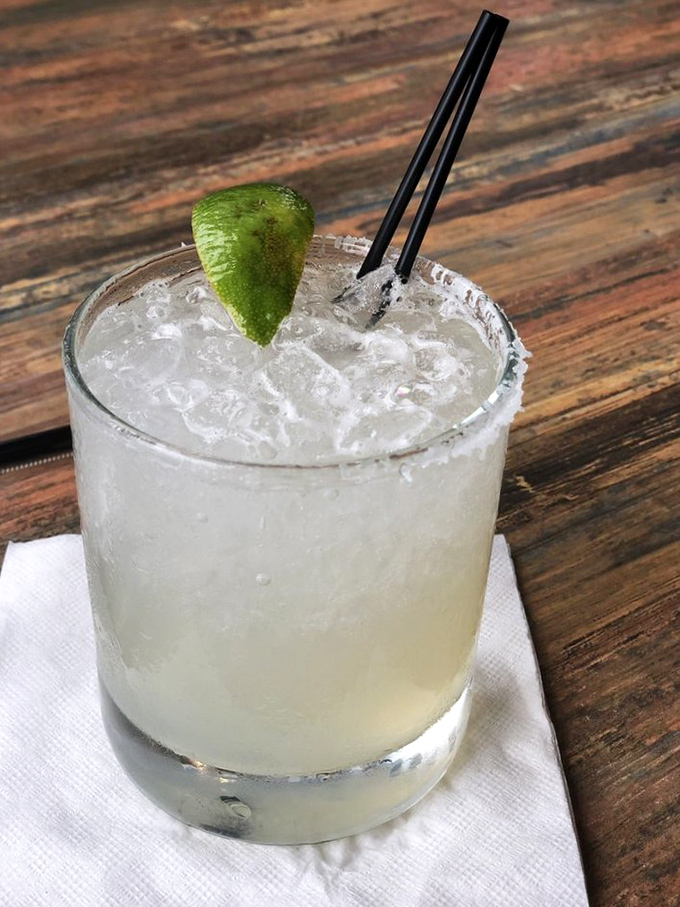 When your margarita arrives looking this refreshing, you know someone in the kitchen understands proper priorities.