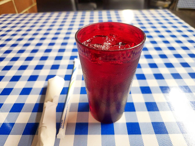 That crimson sweet tea isn't just a beverage&mdash;it's liquid Southern hospitality, served in a glass that's seen a thousand stories.