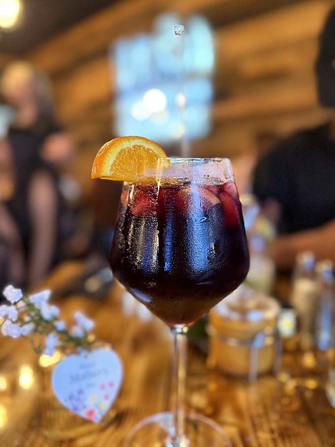 Tables waiting for conversations to unfold, each wooden surface telling stories of celebrations past and "did you taste that?" moments to come. 