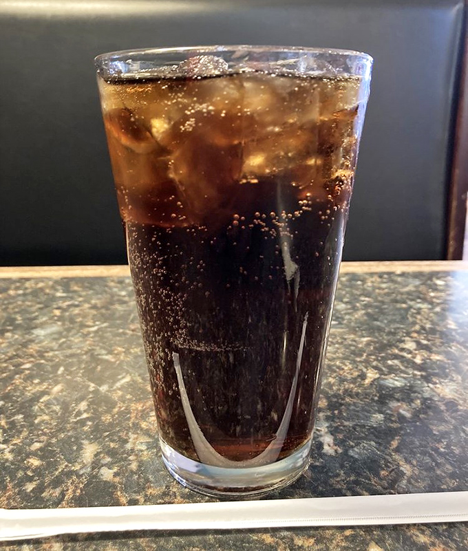 Even the soda looks better here. That glass of cola with perfectly melting ice is the supporting actor that deserves an Oscar.