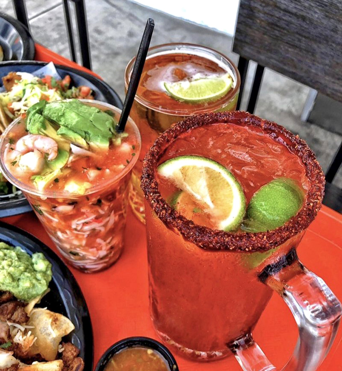 These aren't just drinks; they're liquid celebrations with chili-rimmed glasses and lime wedges perched like little tropical birds on the edge.