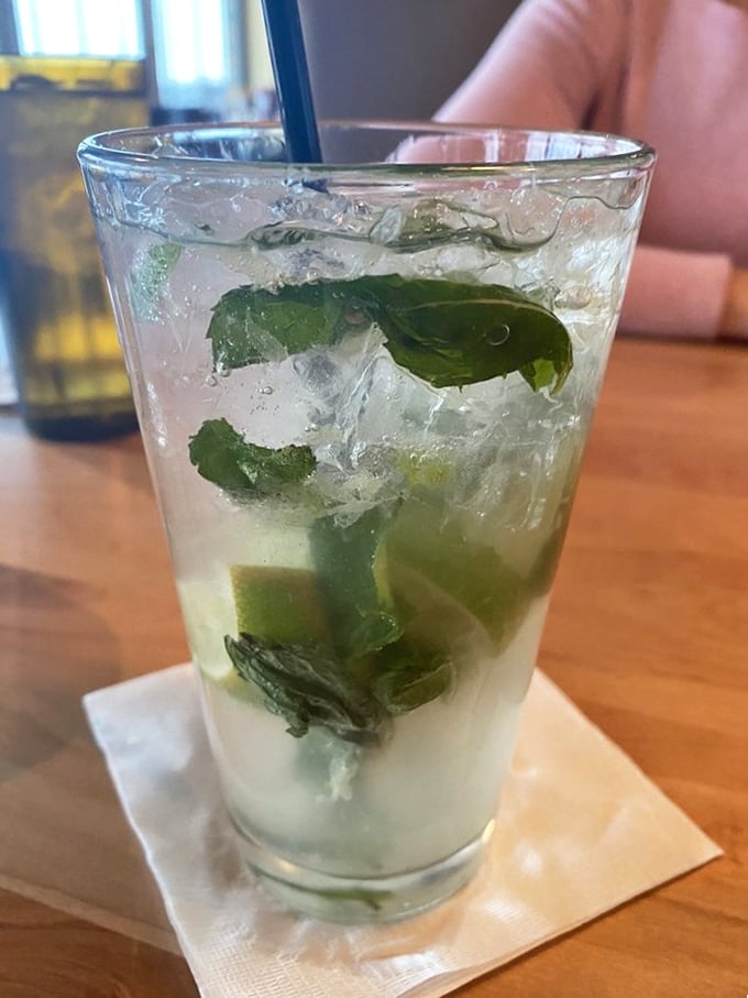 A mojito that refreshes like the cool breeze at 30,000 feet—mint, lime, and rum creating the perfect cocktail coordinates for your dining journey.
