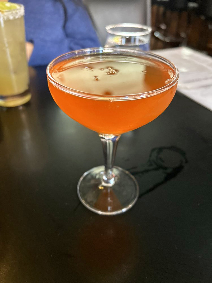 The amber glow of this perfectly balanced cocktail suggests sophistication, while the casual setting reminds you pretension isn't on the menu here.