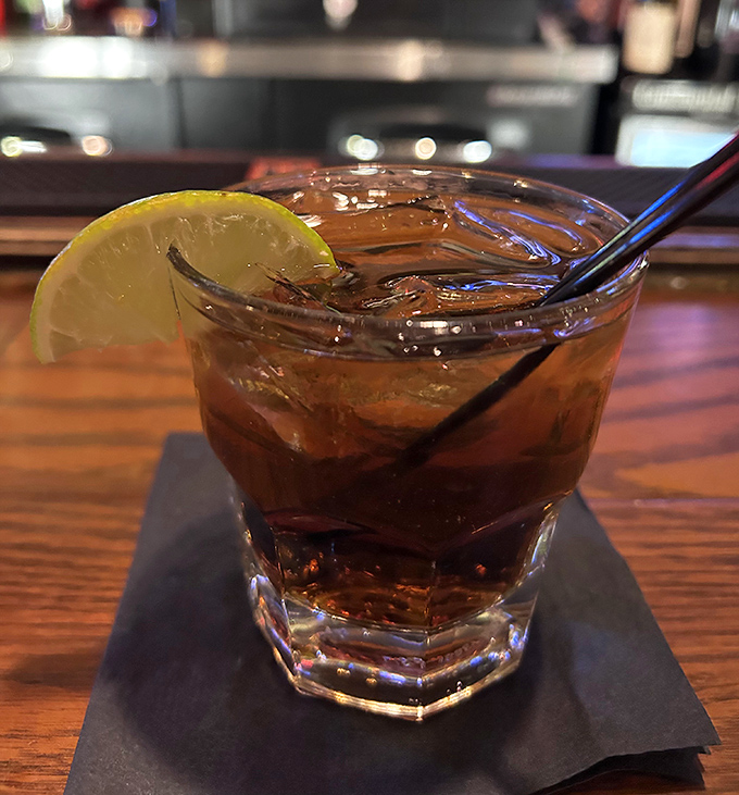 A properly made old-fashioned with a twist of citrus—because sometimes the best appetizer is liquid courage in a rocks glass.