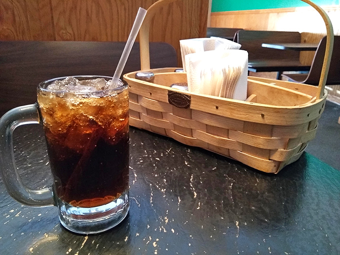 Nothing fancy here&mdash;just an honest soda in a proper mug alongside a napkin basket that says, "We know you're about to enjoy something messy."