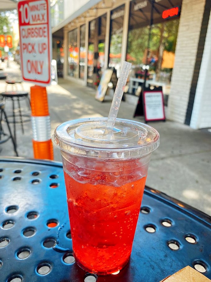 That vibrant red drink isn't just refreshing&mdash;it's like summer in a cup, the perfect cool counterpoint to Harrell's hot dog heat.
