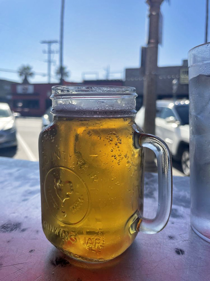 Beer served in a mason jar&mdash;because when you're eating a burger this good, your beverage deserves equally unpretentious presentation.