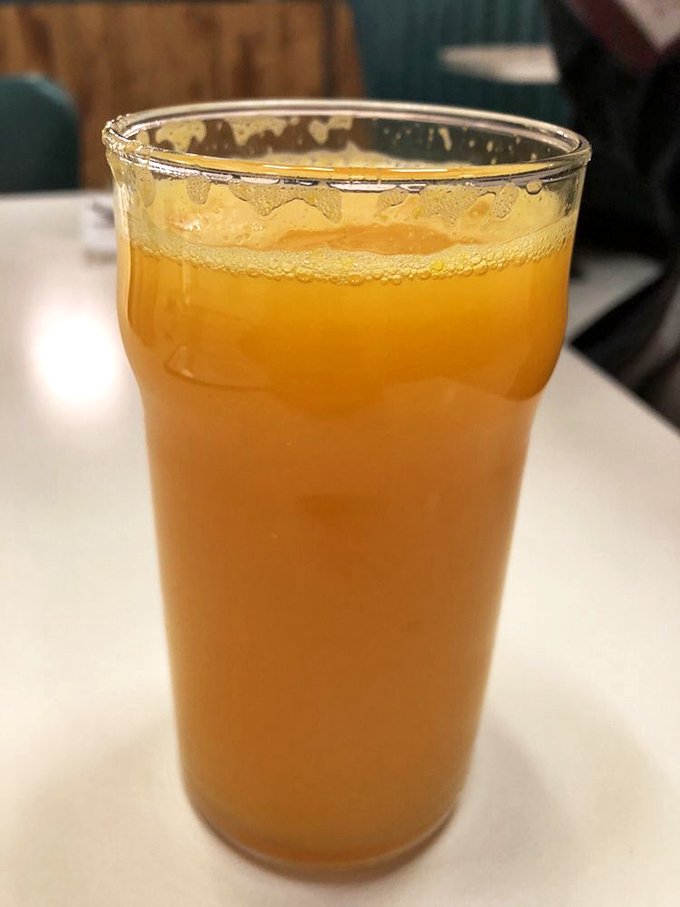 Fresh-squeezed orange juice that's actually the color nature intended. No neon science experiments here&mdash;just pure sunshine in a glass.