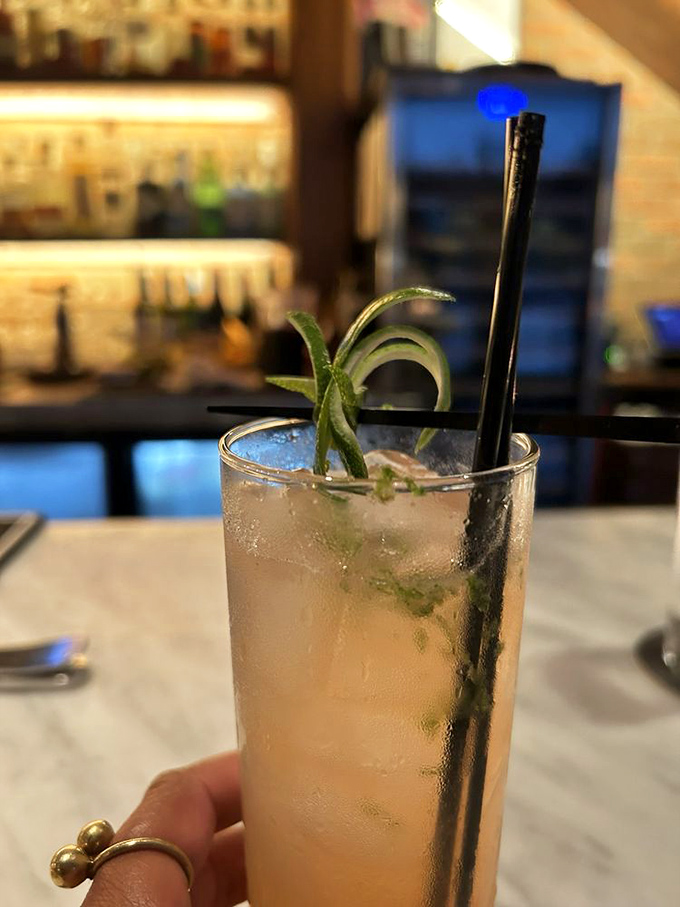 The cocktail that whispers "vacation" even on a Tuesday, garnished with fresh herbs that mean business.