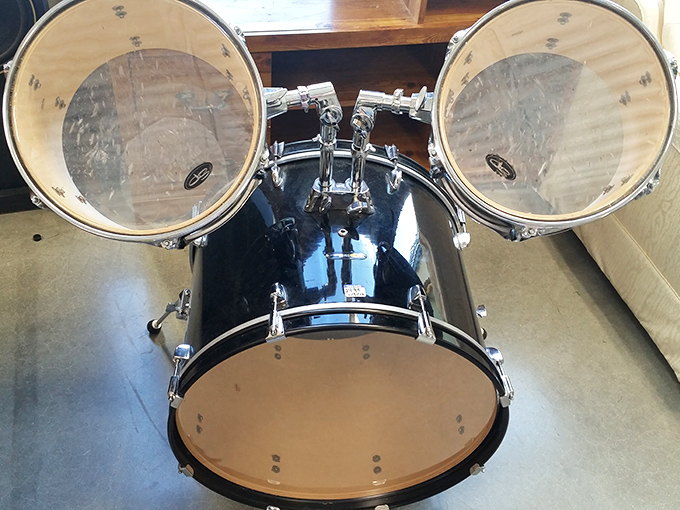 This pristine drum kit sits patiently, perhaps dreaming of its next garage band glory or a retiree finally pursuing that rock star dream.