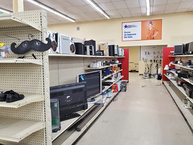 Electronics from every era congregate peacefully, proving that old TVs and new dreams can share the same shelf space.