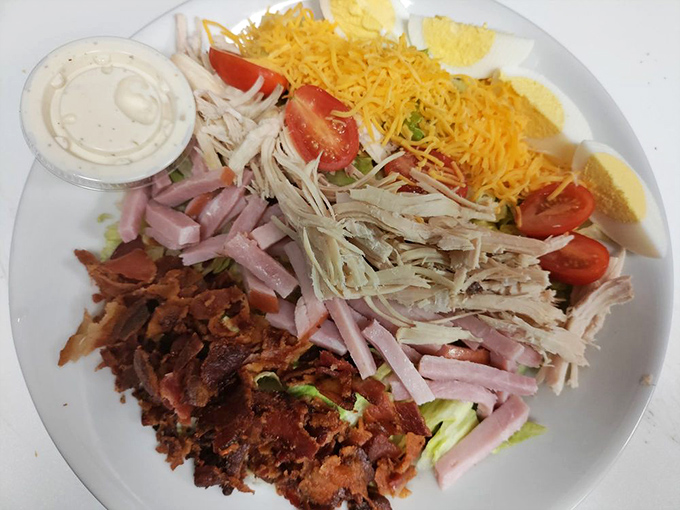A chef salad that defies the sad desk lunch stereotype. When vegetables get this much respect, even dedicated carnivores might consider switching teams. At least temporarily.