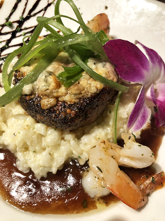 Surf meets turf in perfect harmony&mdash;a beautifully seared steak crowned with blue cheese, accompanied by shrimp that didn't travel far to reach your plate.