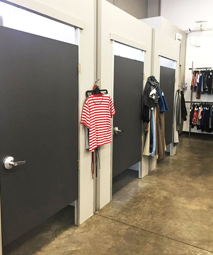 Fitting rooms: where thrift dreams meet reality. That striped shirt hanging outside has "French Riviera vacation" written all over it.
