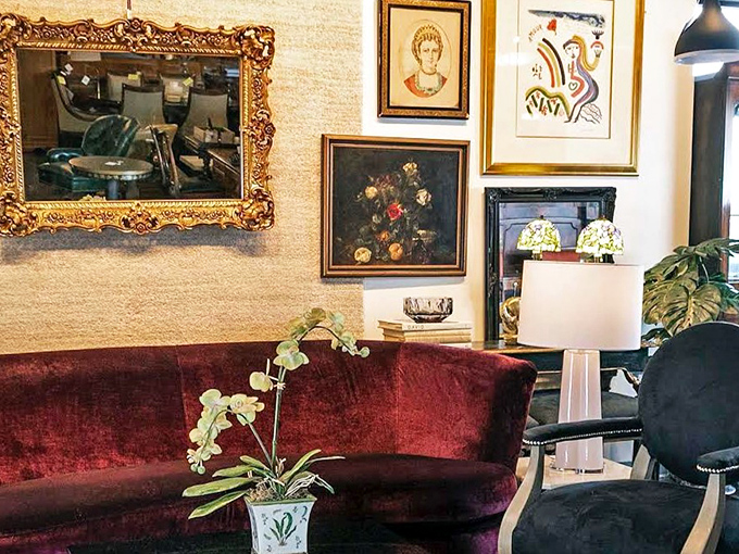 That burgundy velvet sofa isn't just furniture—it's a time machine to an era when people dressed for dinner and phones stayed on walls.