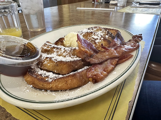 French toast that's dressed for success with a dusting of powdered sugar and bacon that's achieved that perfect crispy-yet-chewy texture we all dream about.