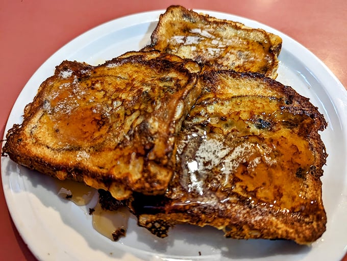 French toast done right transforms simple bread into golden-brown breakfast poetry, thick-cut and ready for your favorite sweet accompaniments.