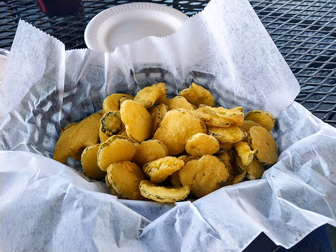 Golden-fried pickle chips: crunchy, tangy time machines that transport you straight to state fair bliss, minus the carnival barkers.