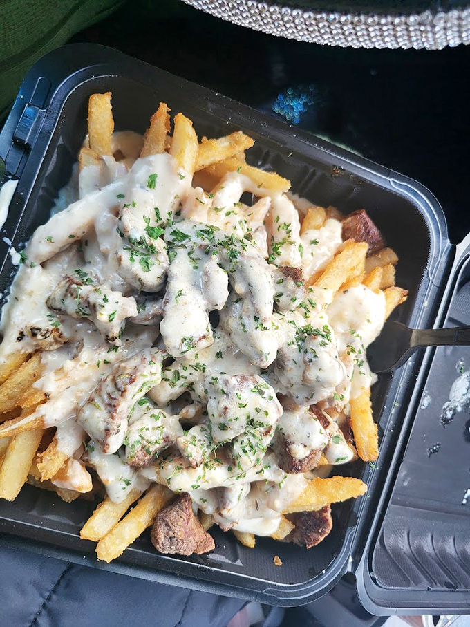 Crispy french fries drowning in creamy sauce create the kind of indulgence dreams are made of.