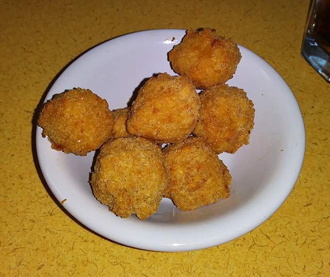 These golden fritters aren't just appetizers; they're little orbs of happiness that make waiting for your main course a pleasure, not a chore.